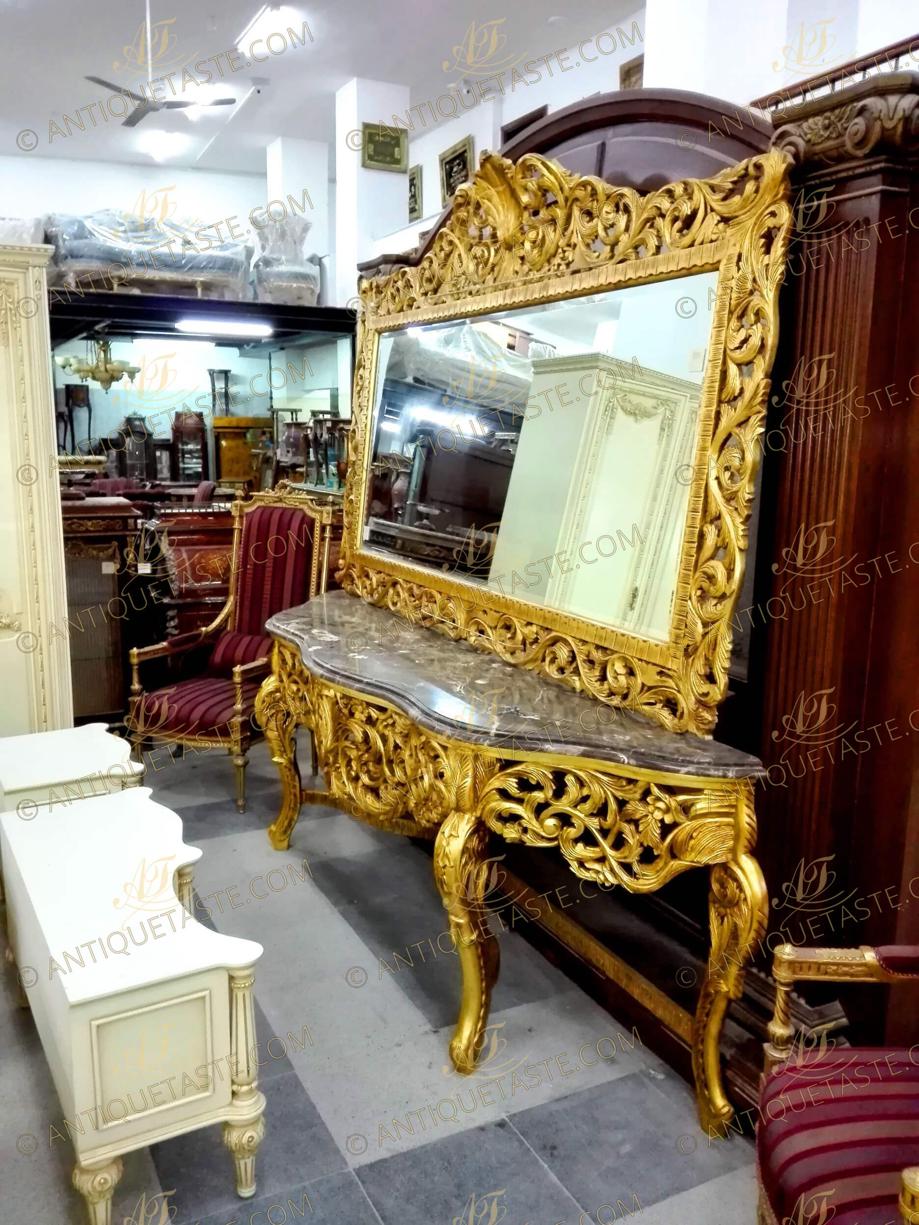 French Louis XV Rococo style carved and gilt wood grand console with mirror