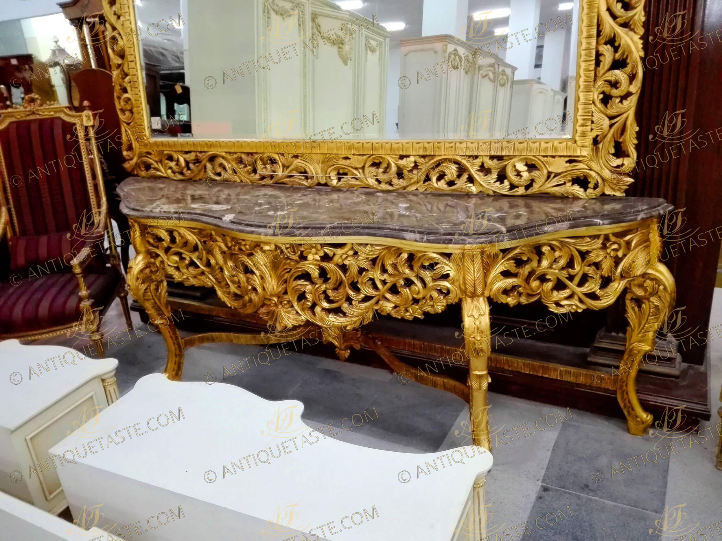 French Louis XV Rococo style carved and gilt wood grand console with mirror